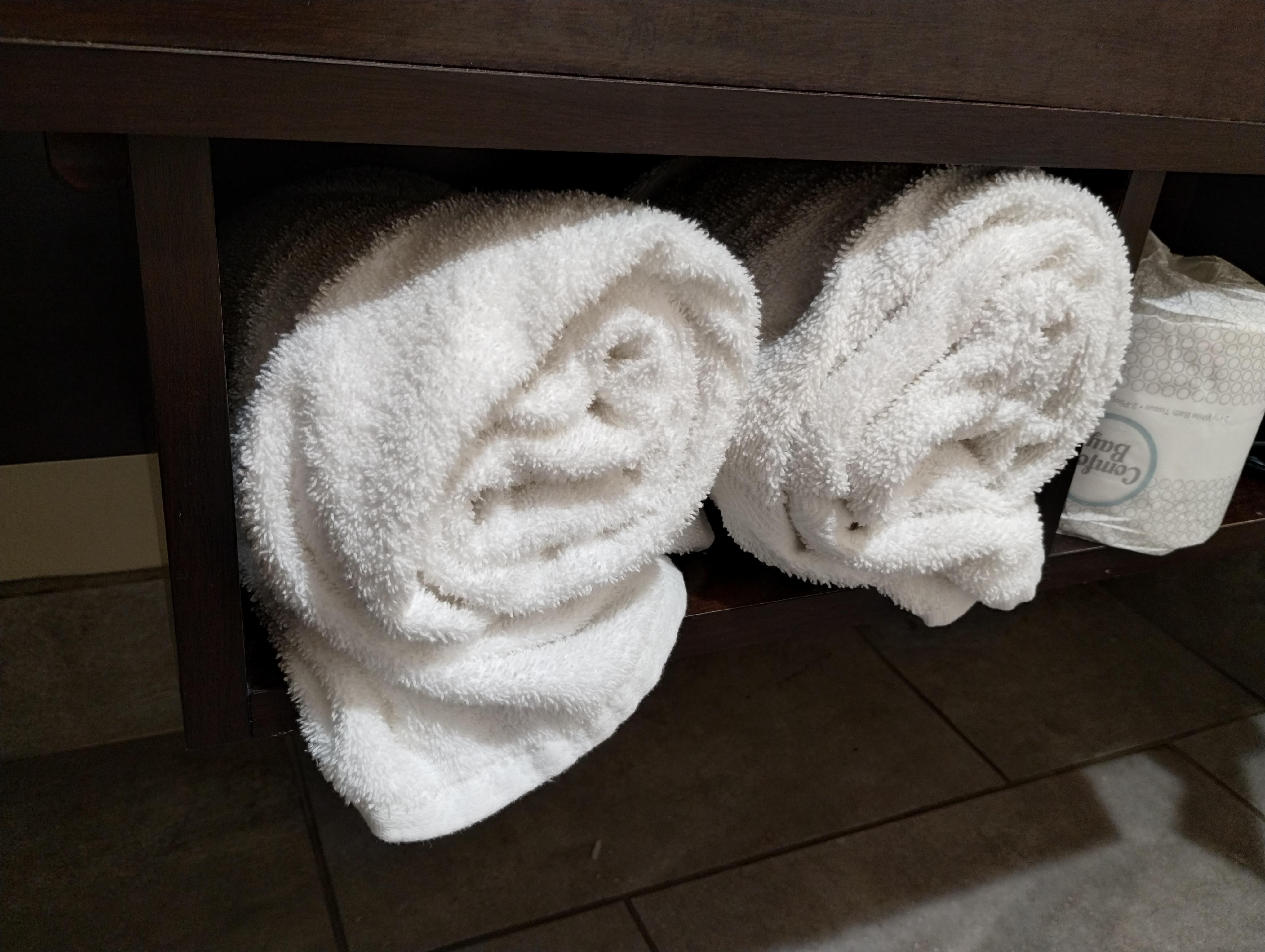 Another white towel & another grey towel 