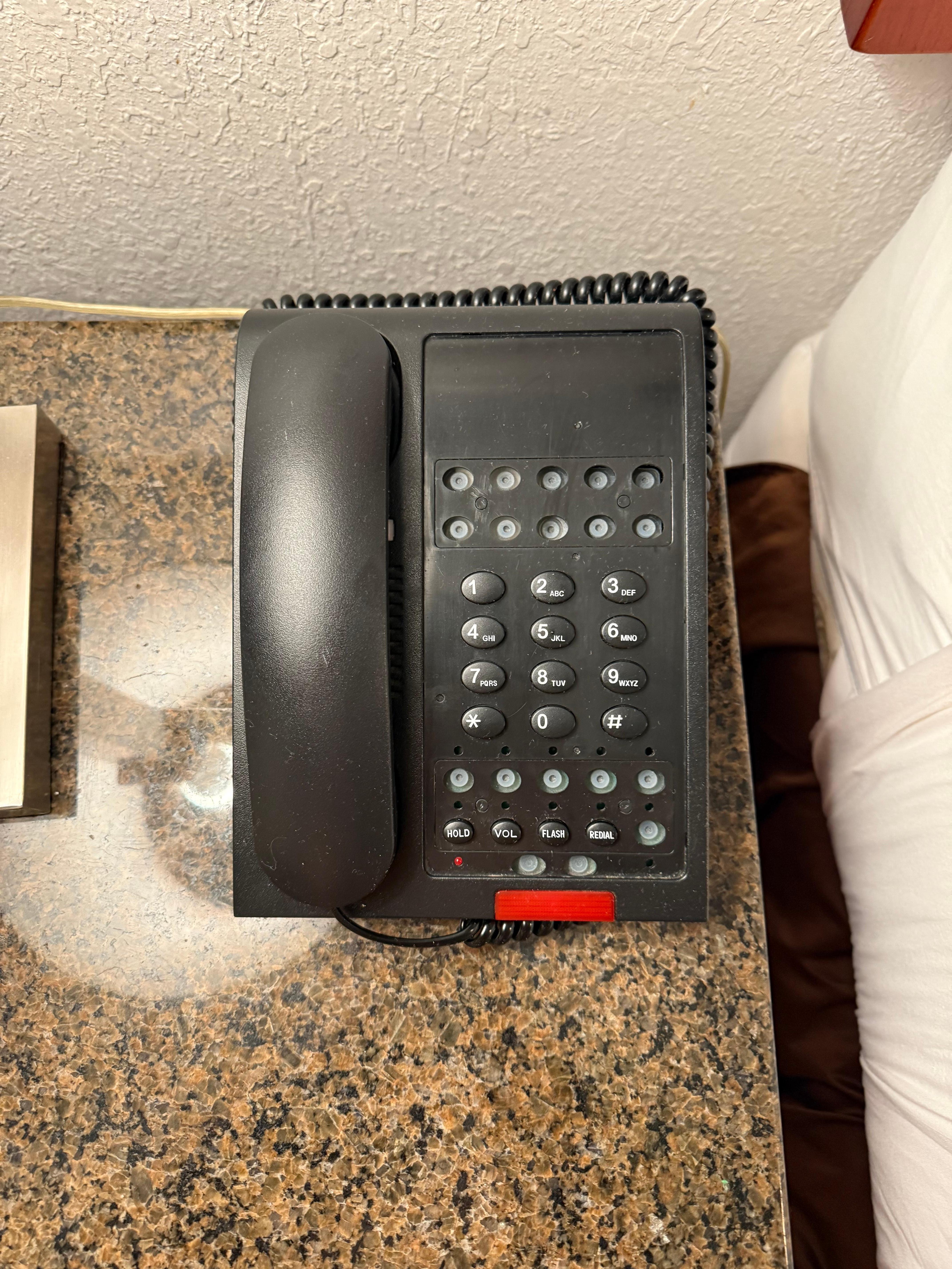 Phone on top of nightstand. 