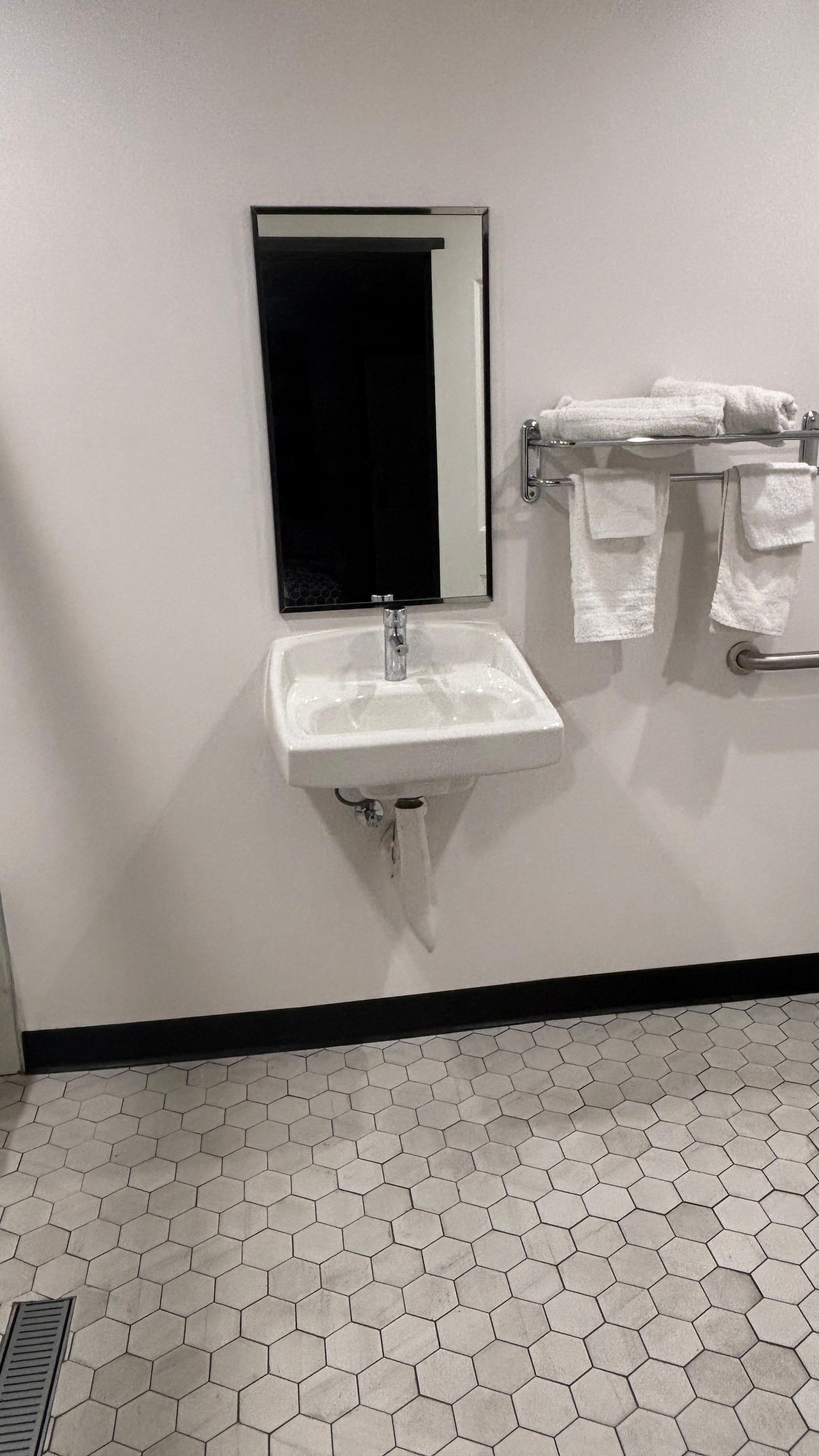 Bath sink with mirror but no counter or outlet