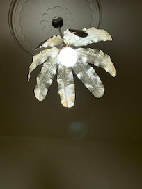 Cool light fixture over bed in Room 1