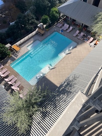 View of pool from hotel room balcony