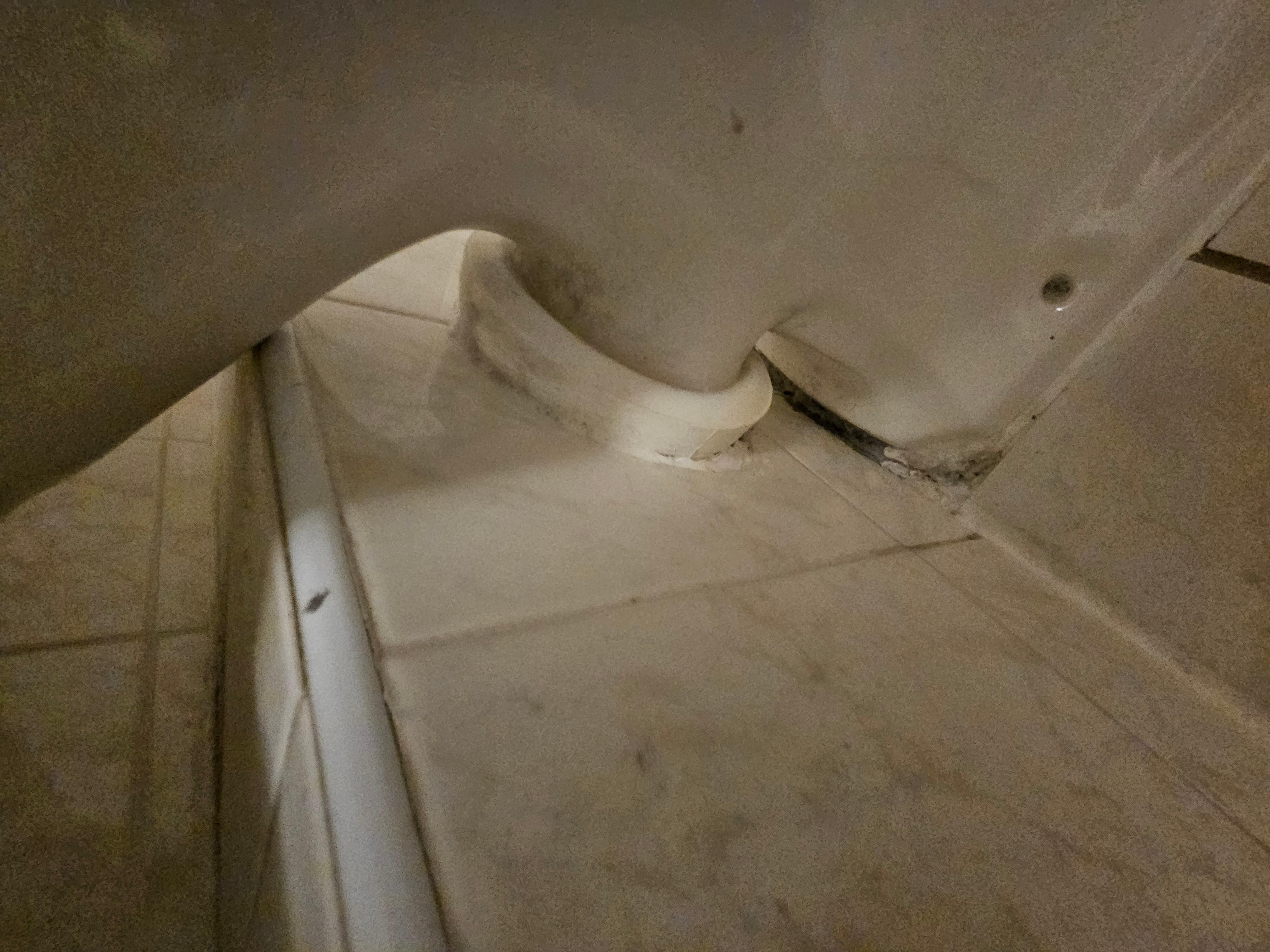 Behind toilet