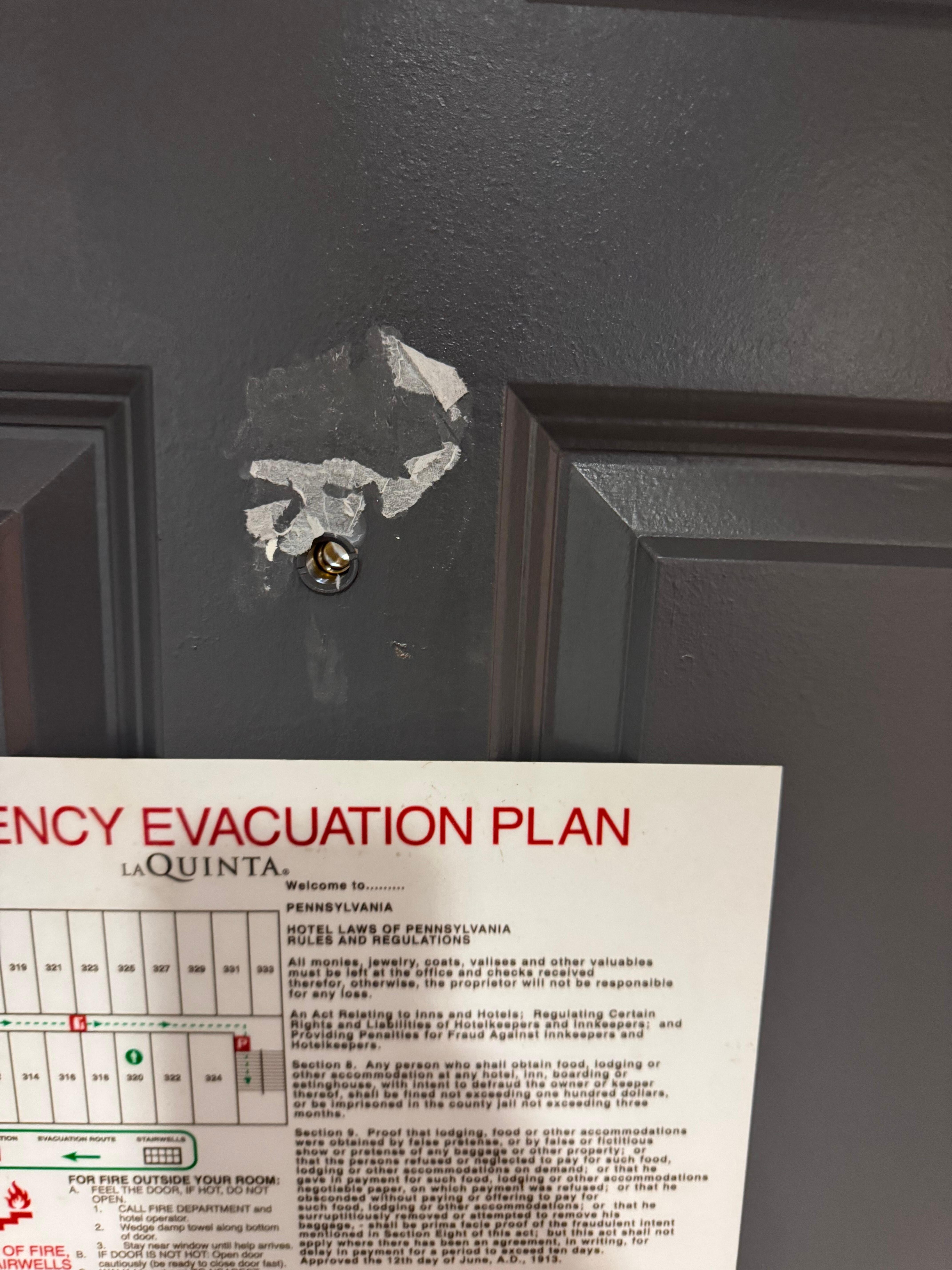 the peep hole in the door looked like someone tried to cover it up.