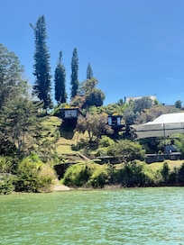 View of the hotel and restaurant/ pool area under the white tent