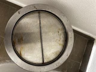 Garbage can was old and full of stains...