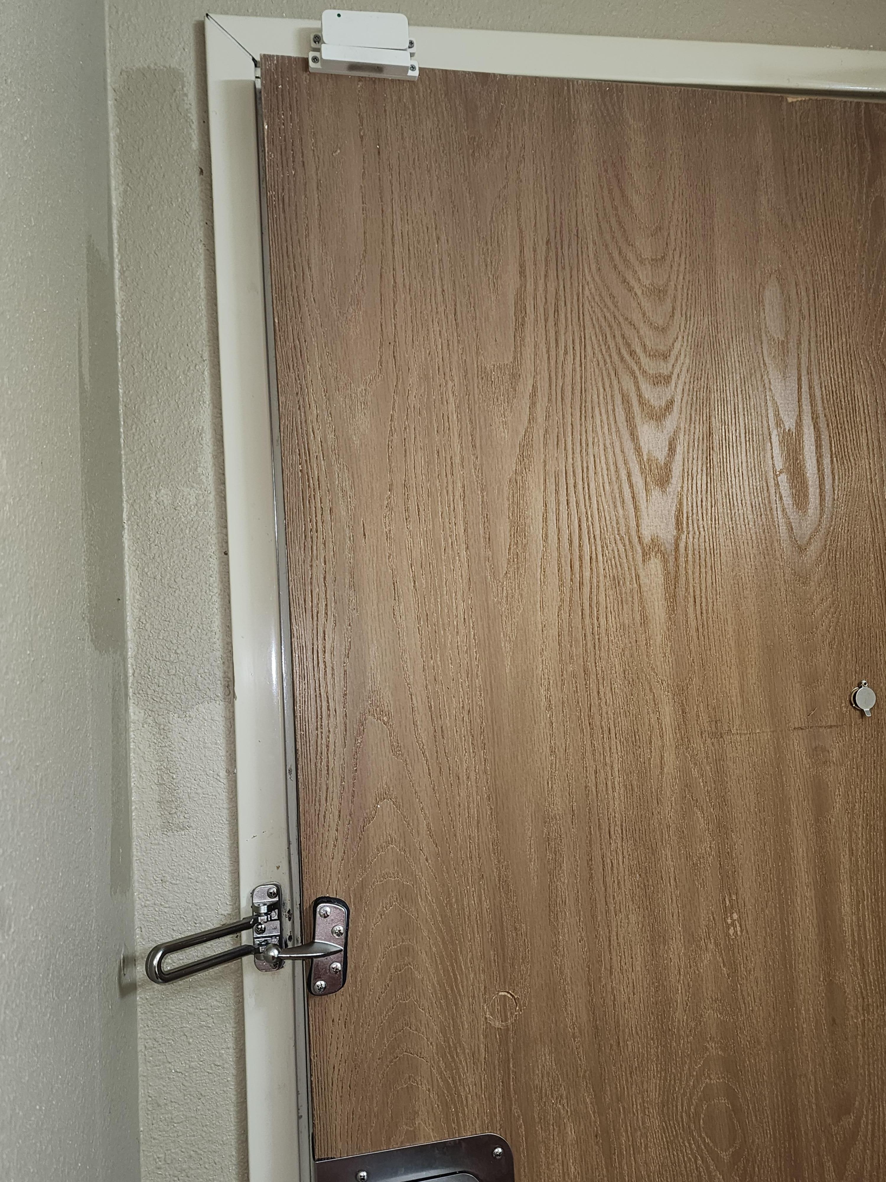 Door wouldn't close (or lock) properly without pulling up harshly on the handle. Door hinge needs maintenance. 