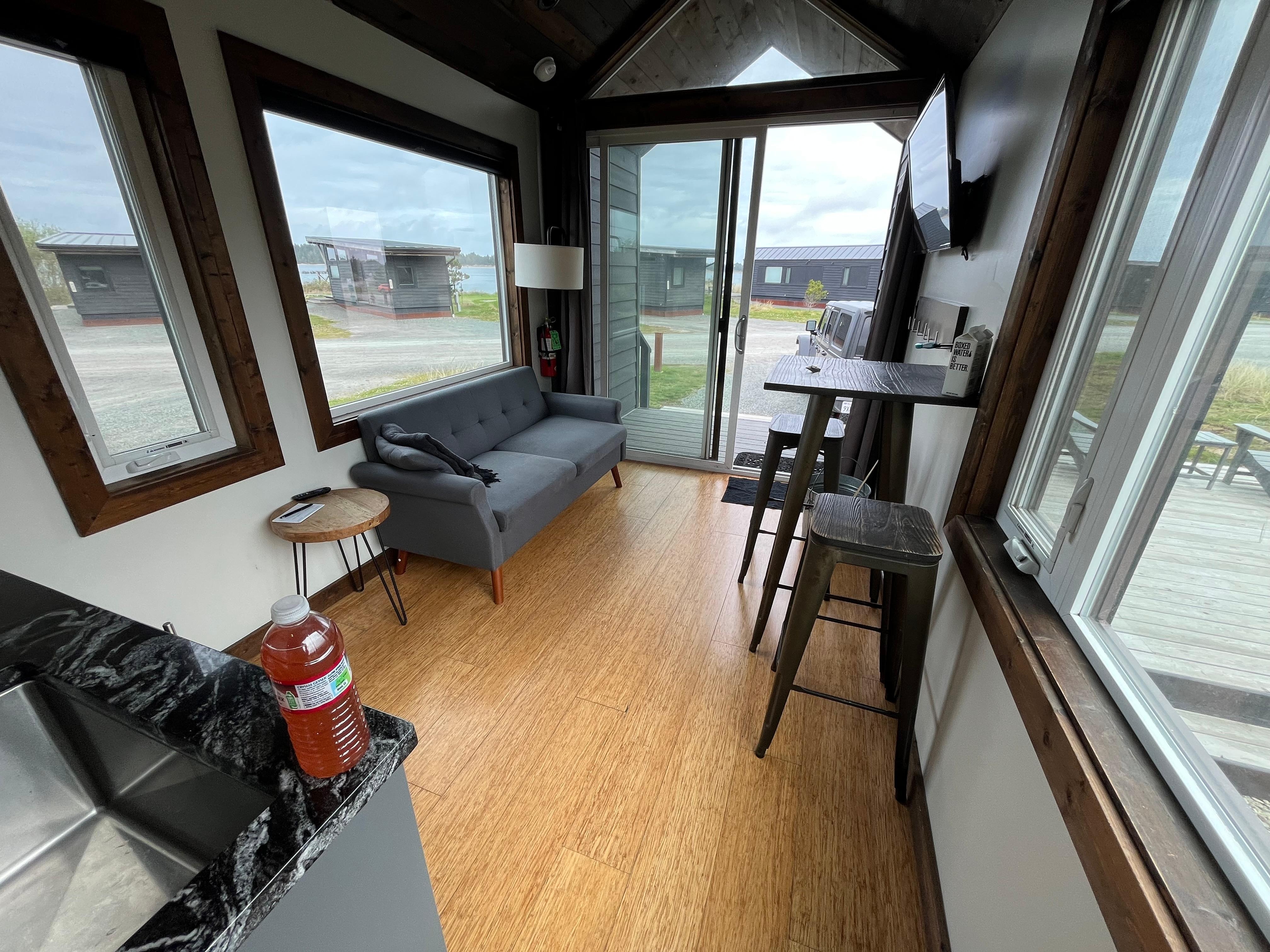 The outside deck with fire pit deck behind. 