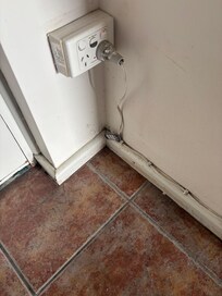 Dirt and paint chips representative of the rest of the room.