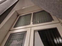 Windows held in with tape