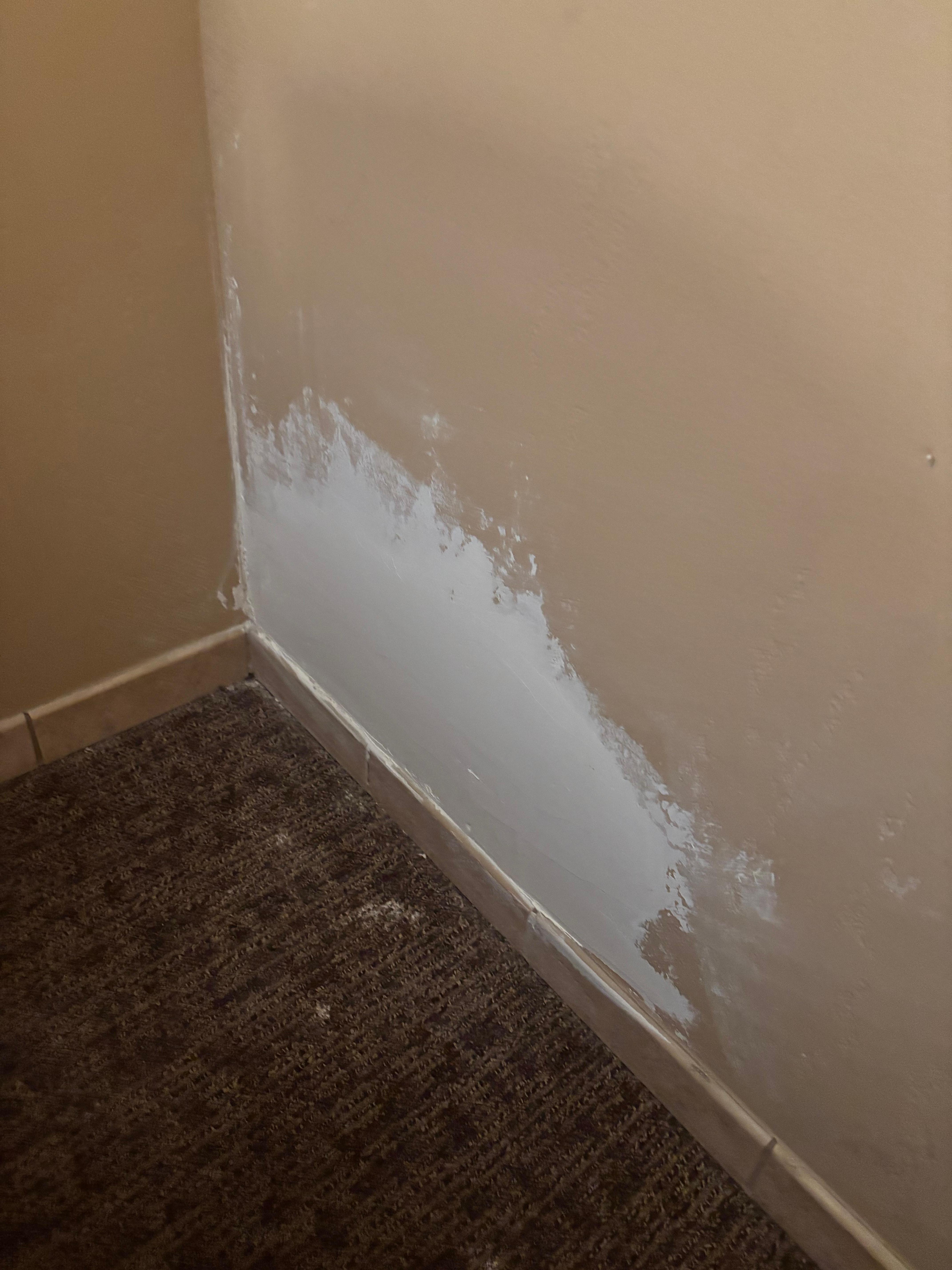Next to bed, apparently they didn’t feel the need to paint before letting guest back in the room