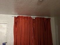 Drapes neither block light out nor seal view from outside. note overhead light not working