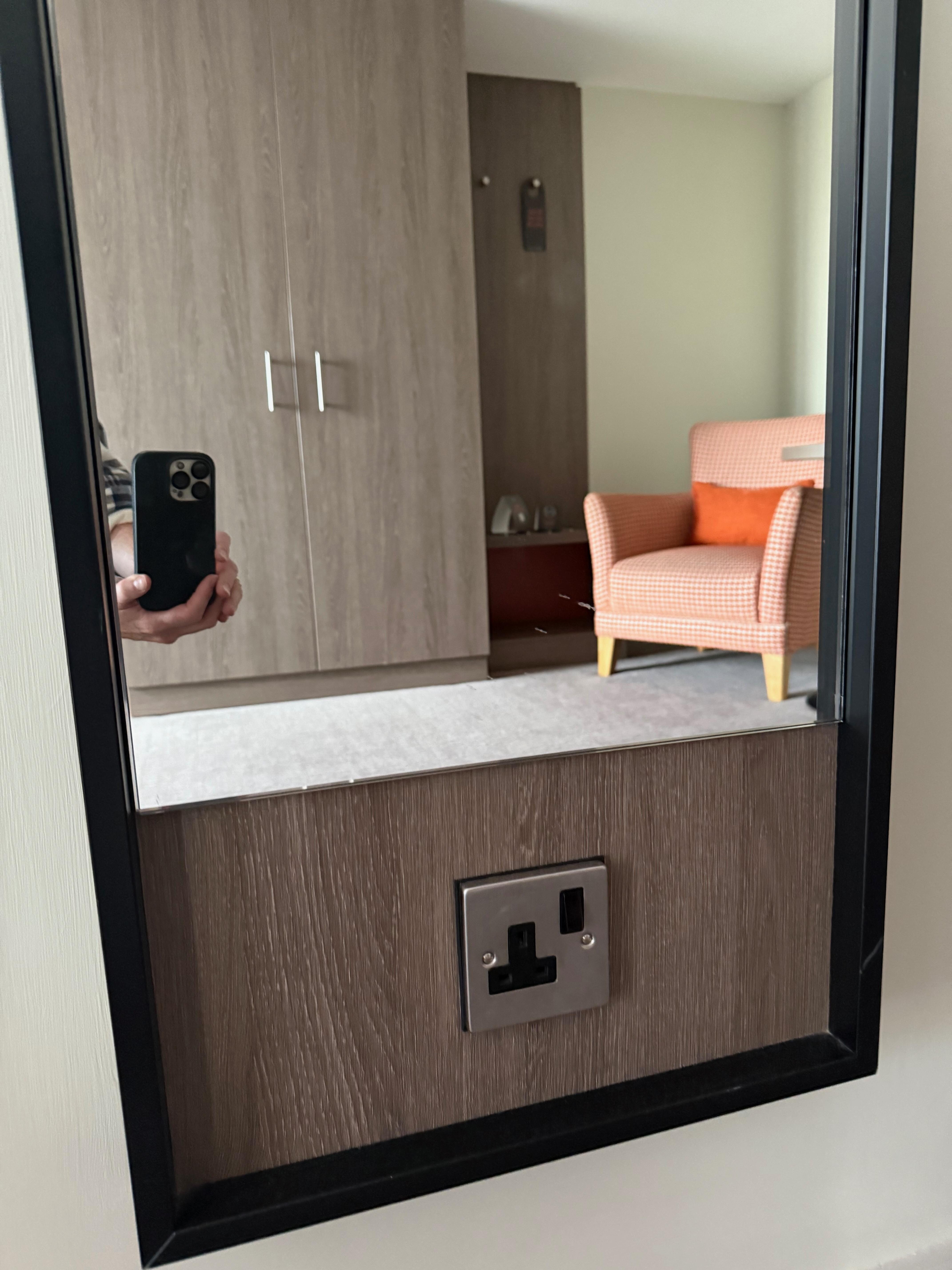 Outlet outside of the bathroom. 