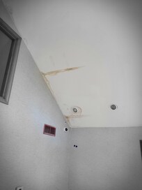 A defective wall outlet covered in ducttape