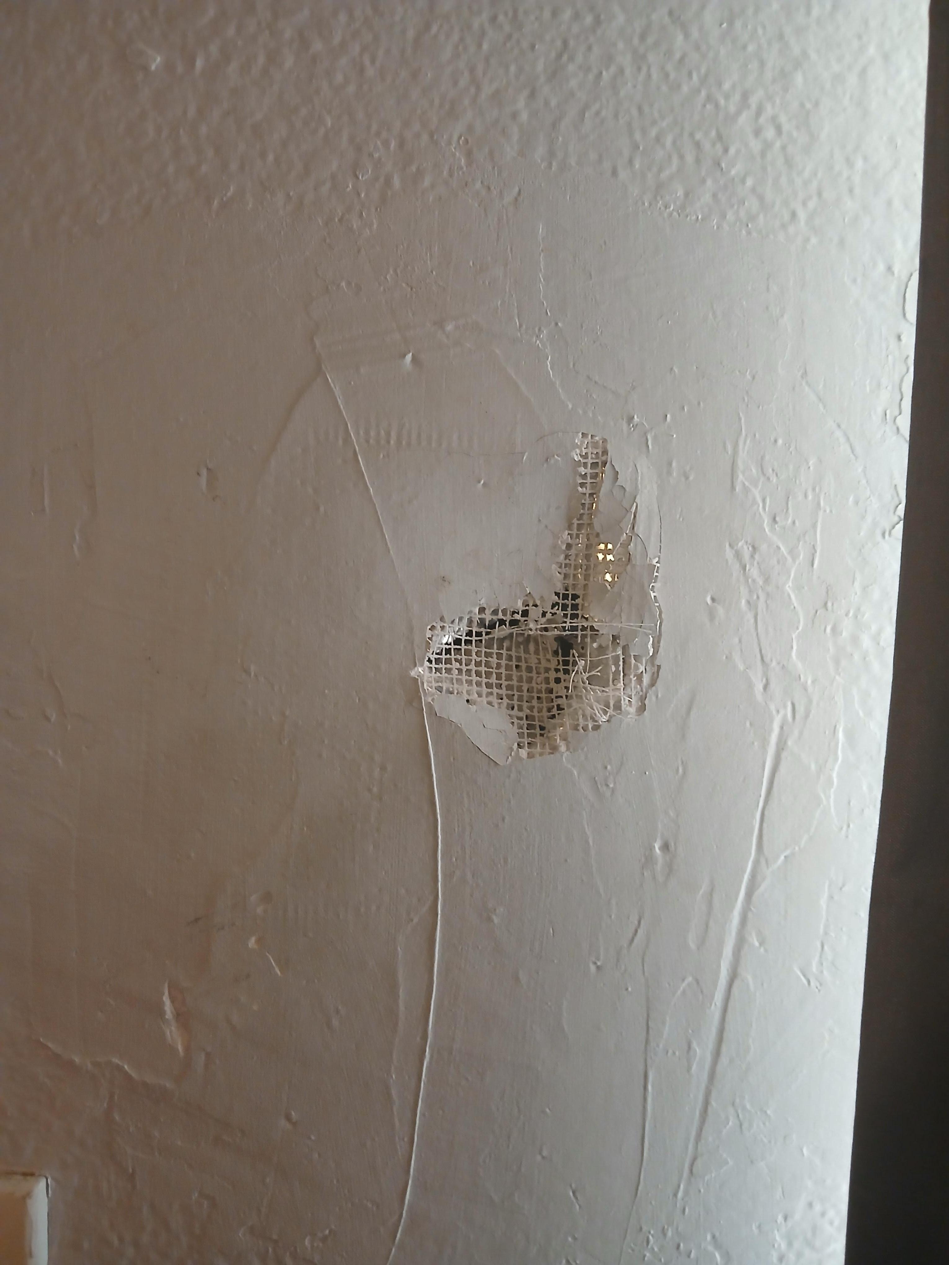Hole in the wall by the front door