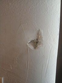 Hole in the wall by the front door
