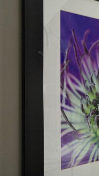 Something running down glass on picture, not cleaned