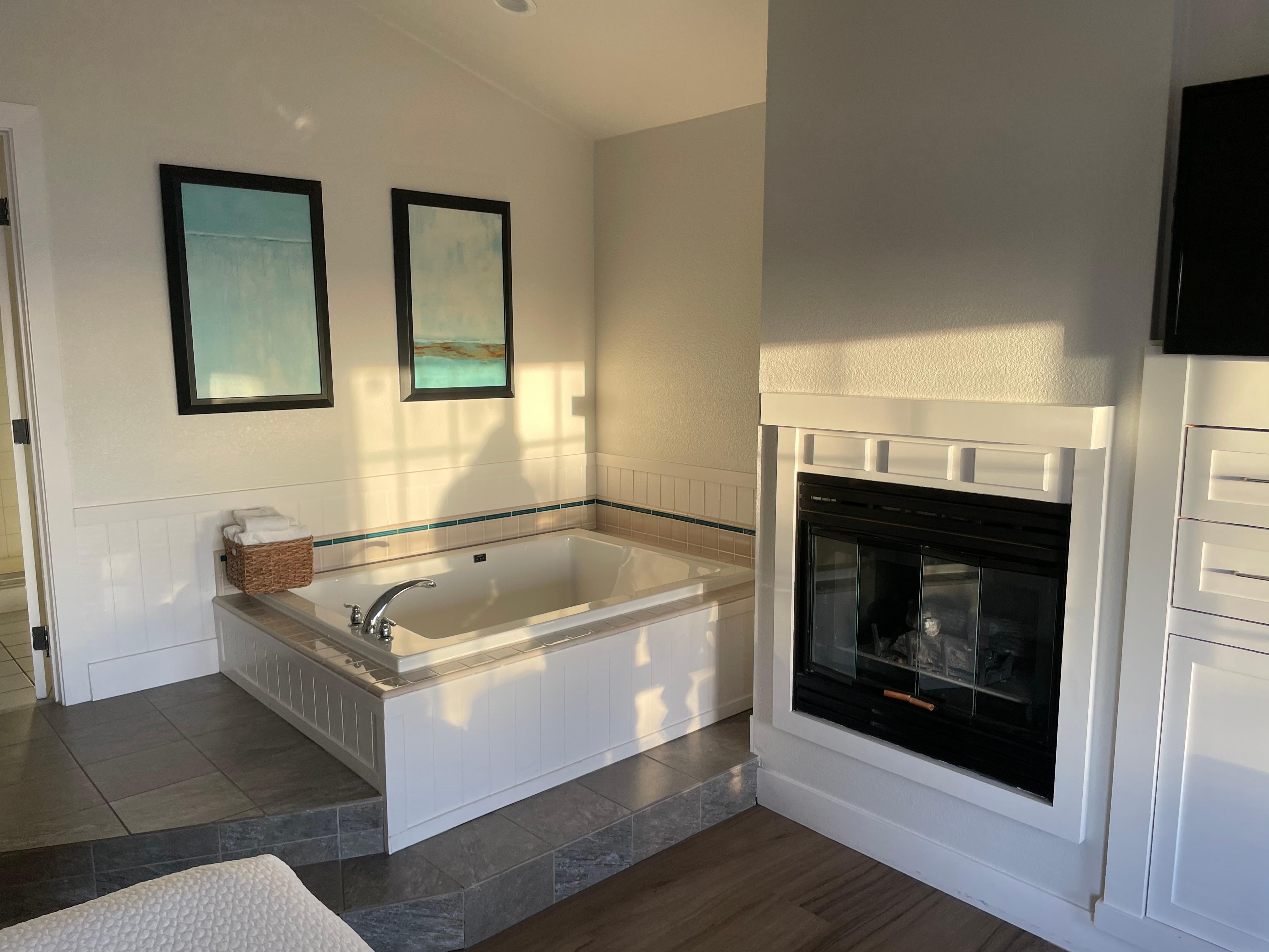Room interior with jet tub and fireplace