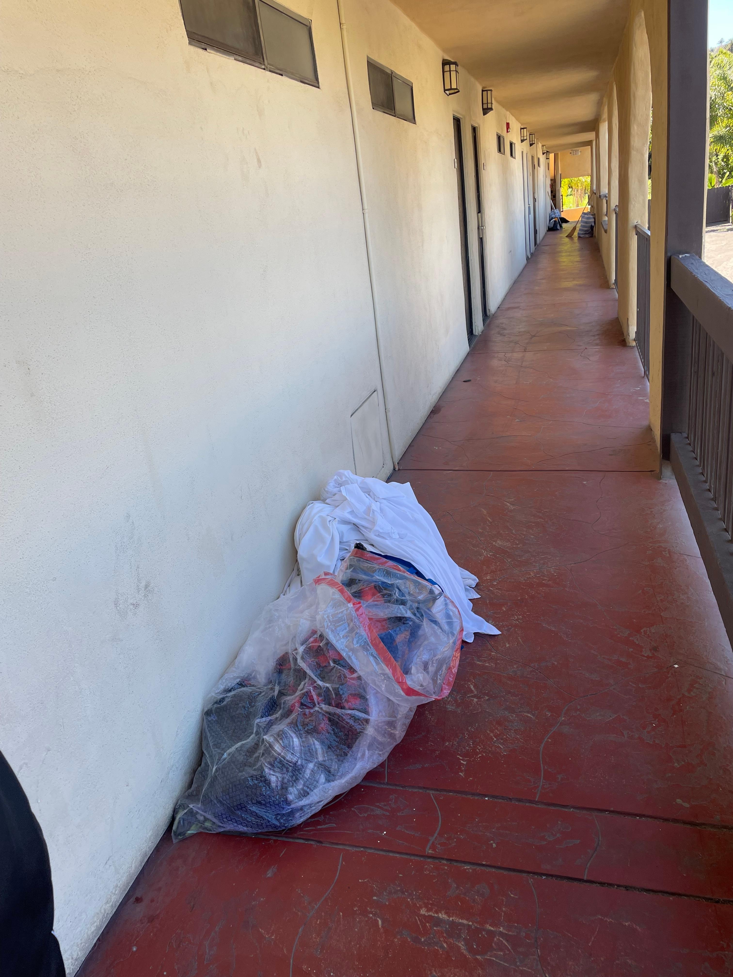 Trash dirty blankets. Along the hallway
