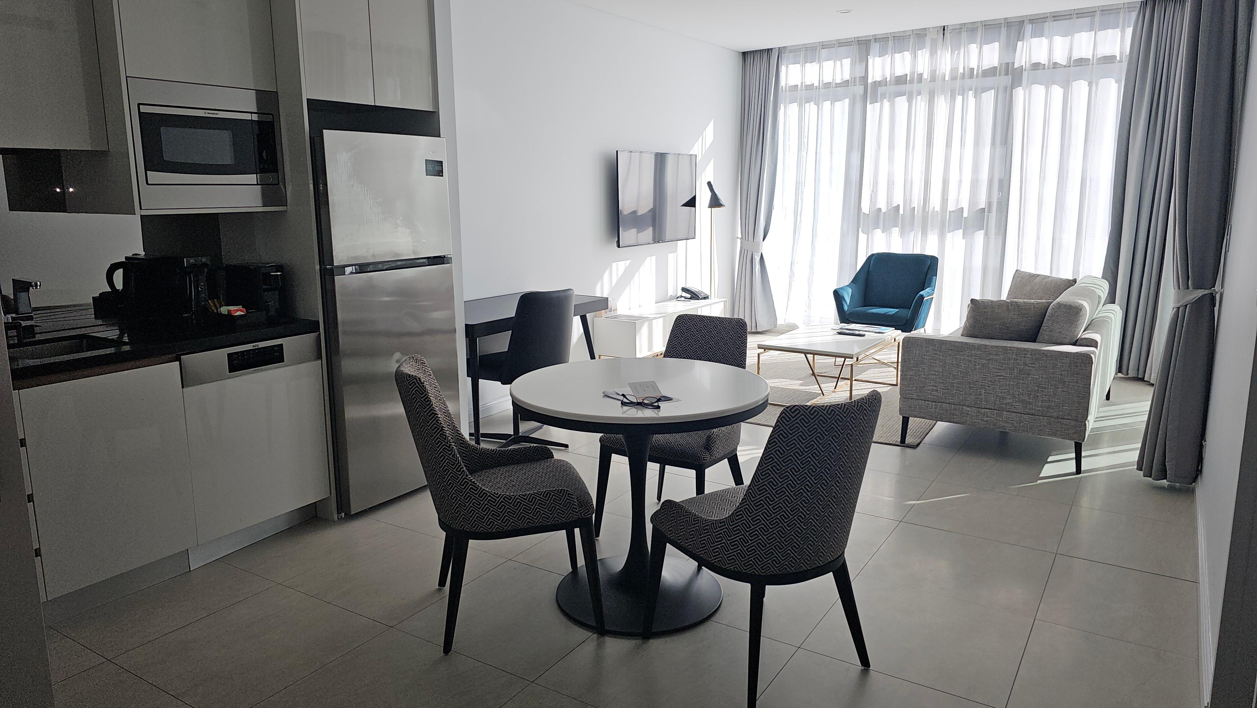 Dining area, sitting area and part of kitchen 