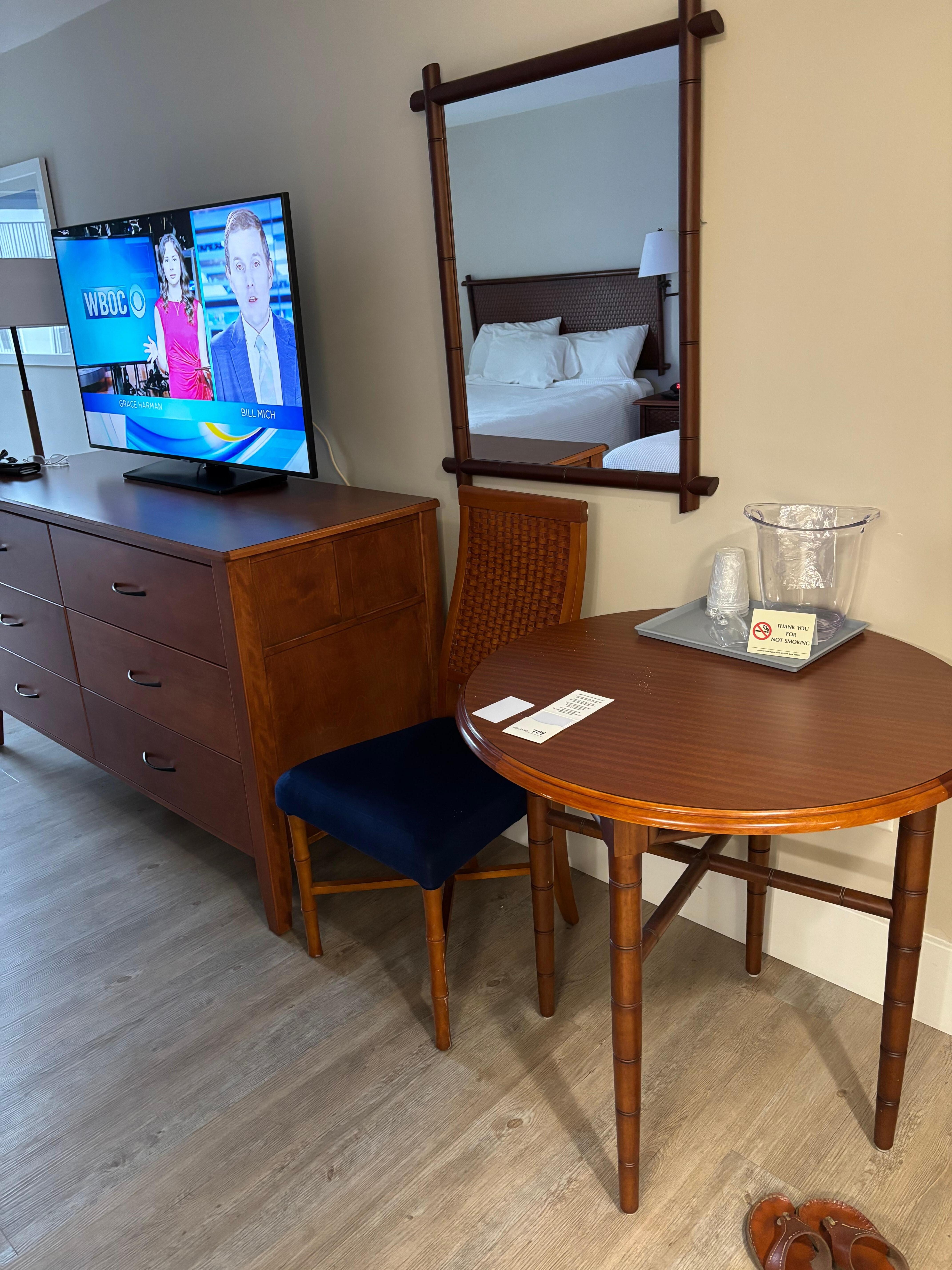 Small table and only one chair in the room. 