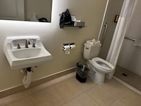 Missing counter top between sink & toilet.Not enough space for toiletries