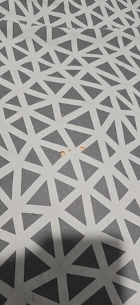Cigarette burns on bedding.
