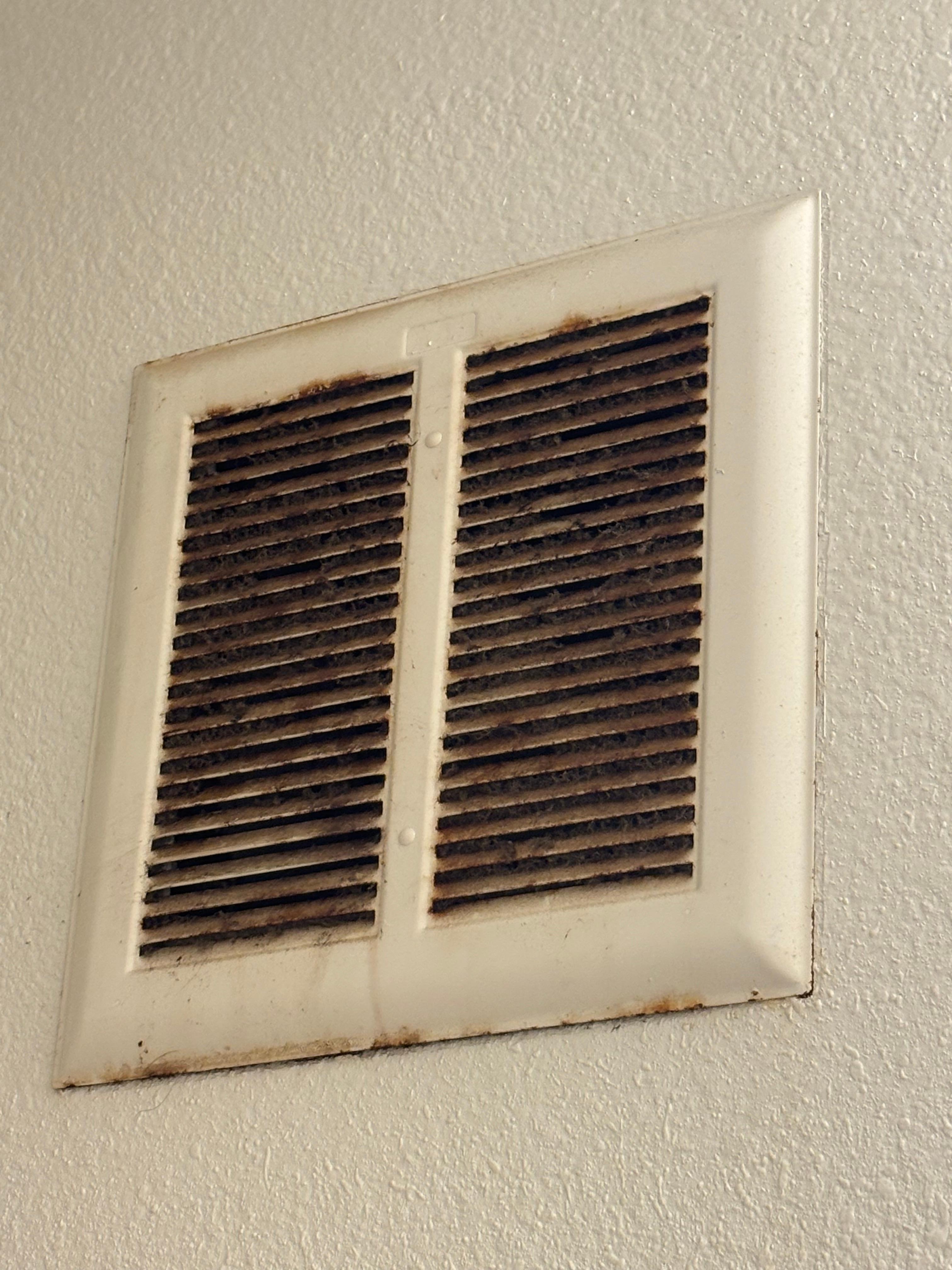 Dirty caked vents in the bathroom 