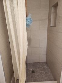 Small shower but love it has built-in toiletry/shower shelf but bring your own toiletries as there's are small generic shampoo & soap
