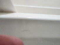 Hair on side of bathtub