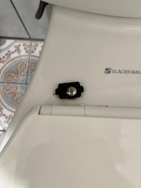 Broken toilet screw, lid/seat kept moving