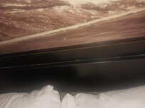 Head board, self were microwave and fridge set on has dust you can write your name in it