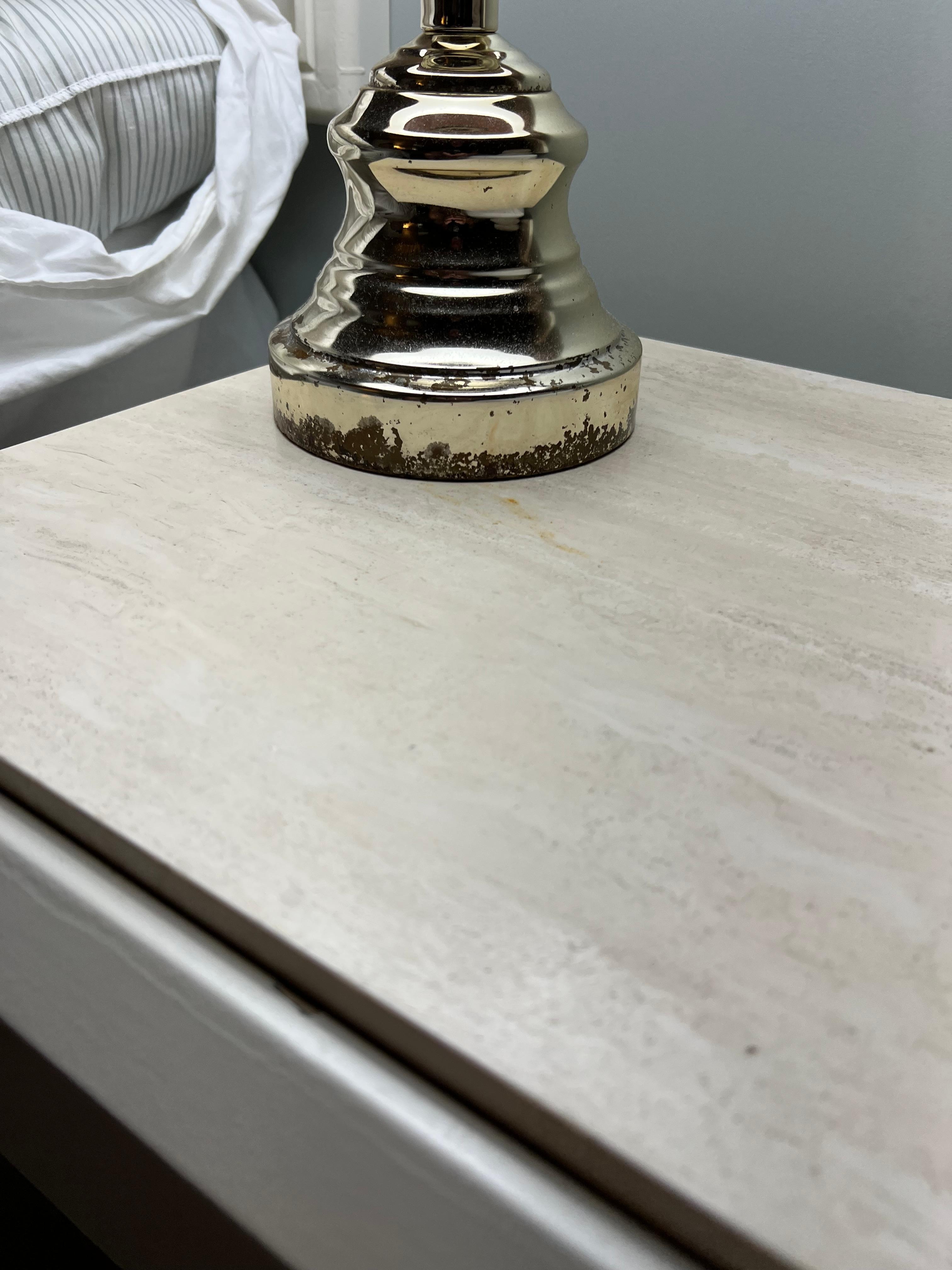 Chipped and rusted lamps and furniture.