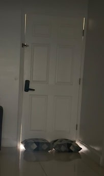 Door to room is a hollow-core interior door with massive gaps. We put pillows in front.