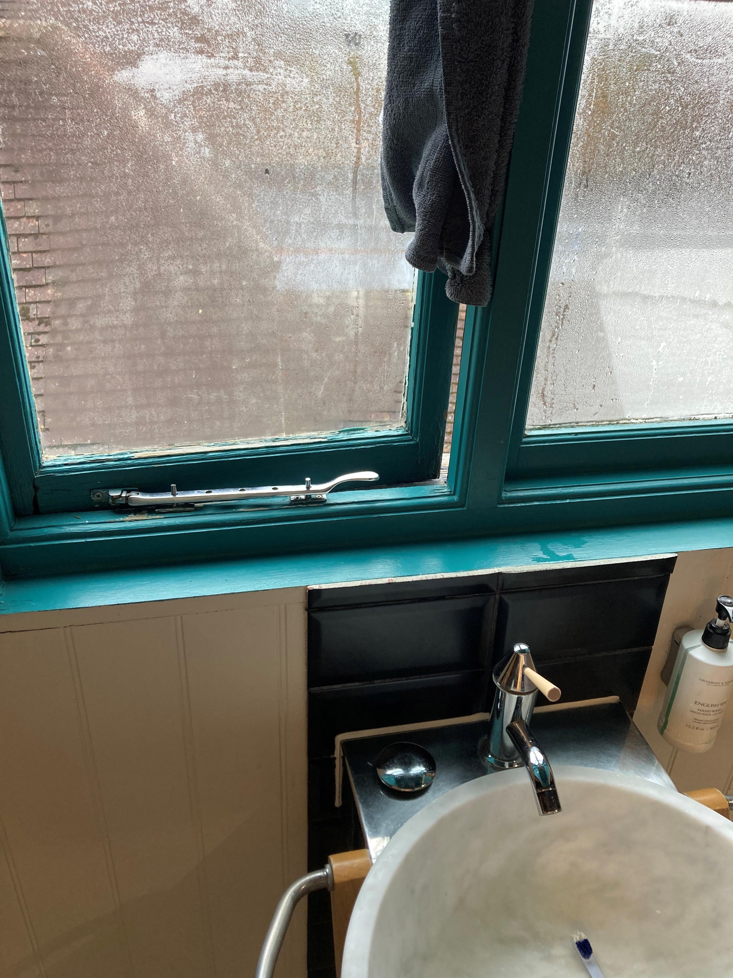 towel used to block freezy draught . The window would not close 