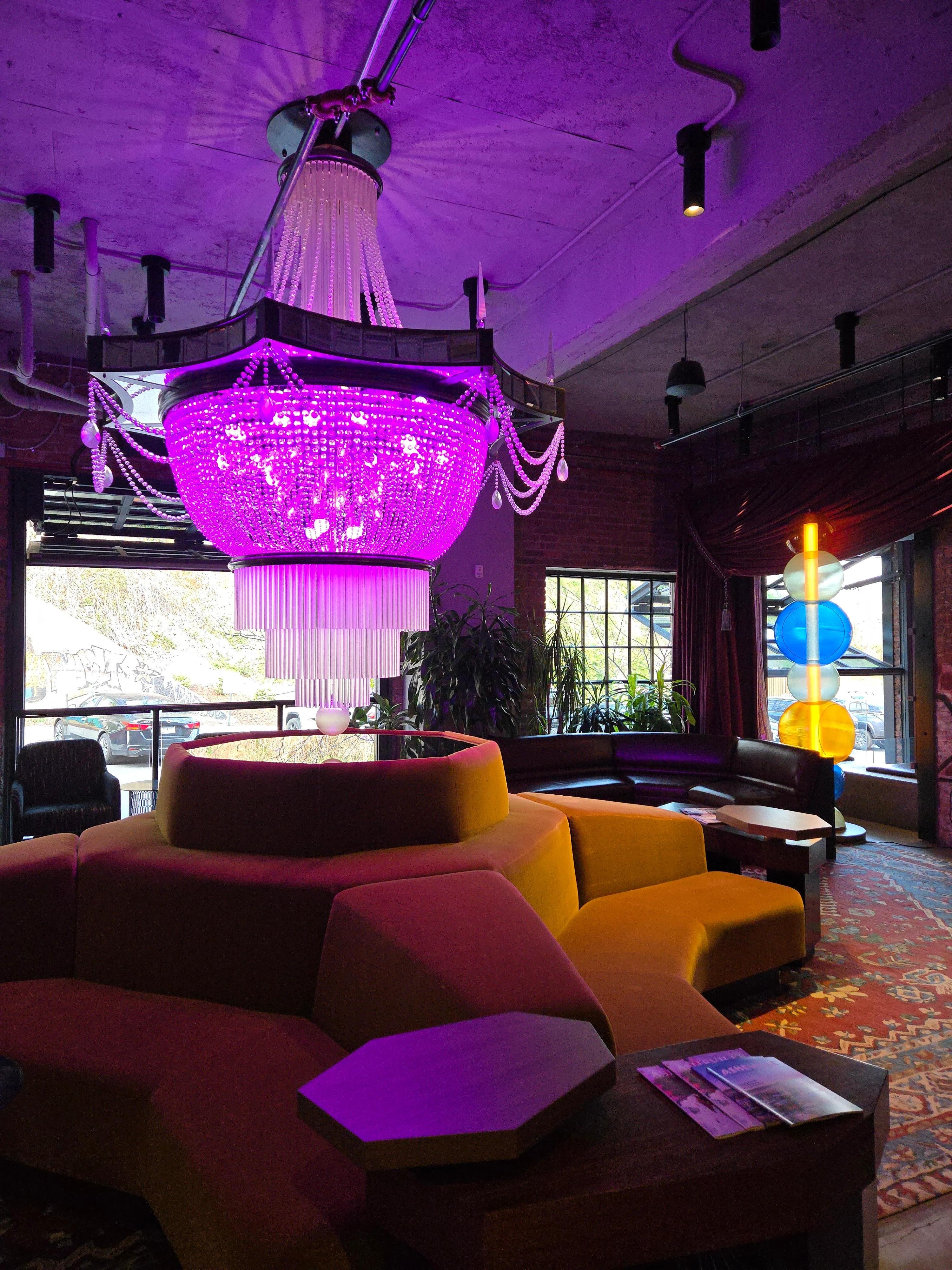 Main lobby with a huge chandelier hung very low.