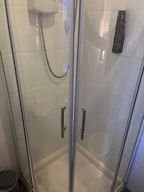 Shower door didn’t close allowing water to cover the floor