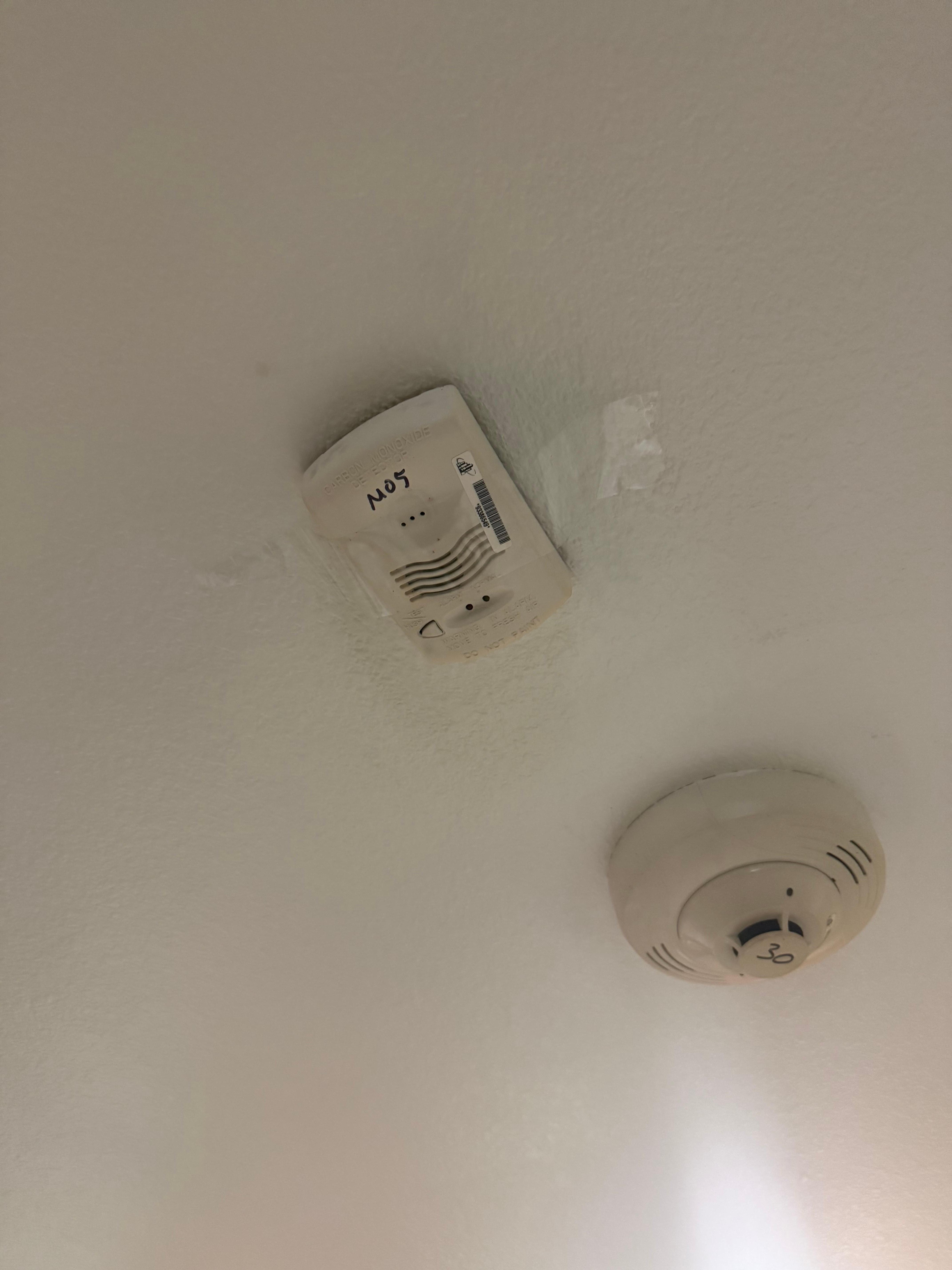 Taped fire alarm to ceiling 