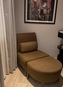 Chaise lounge in living room of suite