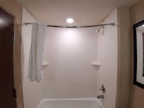 No shower curtain
Soap was filled with water
Dusty air vent