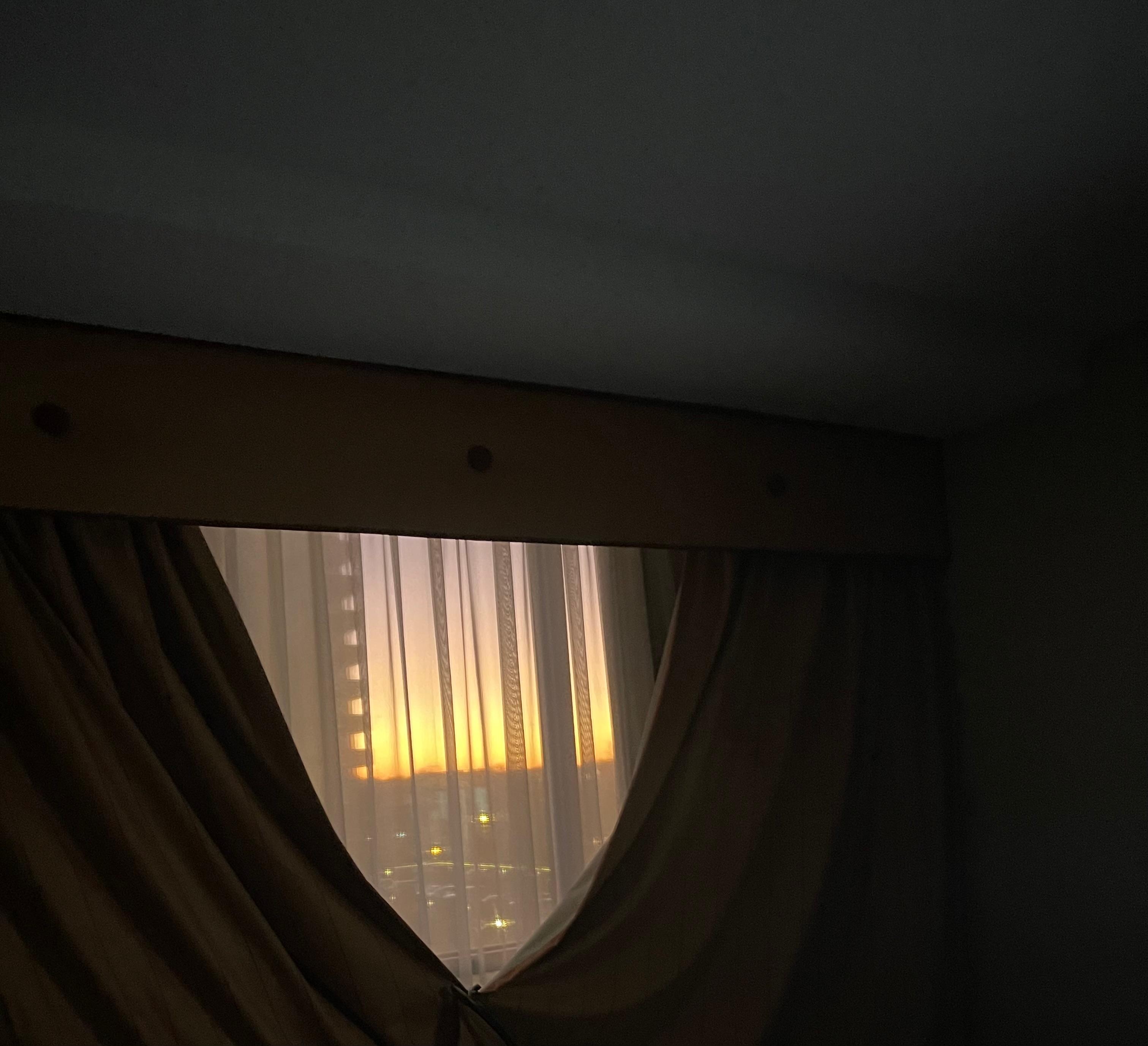 Used a clip and a chair in attempt to filter light .. 