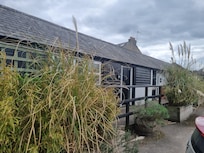 Row of approx 4 rooms like small chalets. Converted stables. Modern decoration.