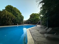 Very nice swimming pool with space between guests.