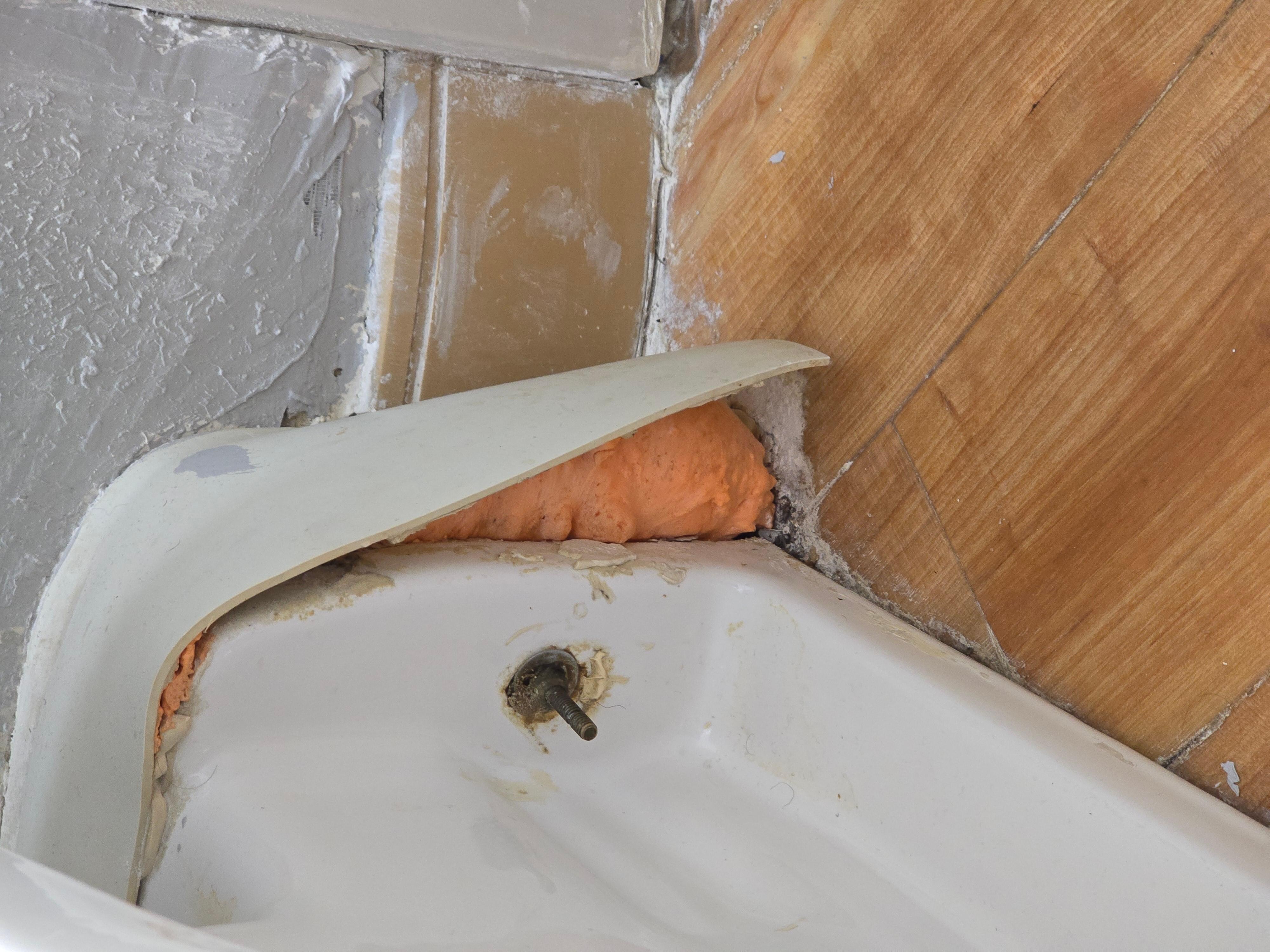 Spray foam holding toilet in place