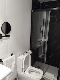 Bathroom is small, a bit dark, but everything works