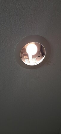 Missing cover for light in bathroom. Safety violation.