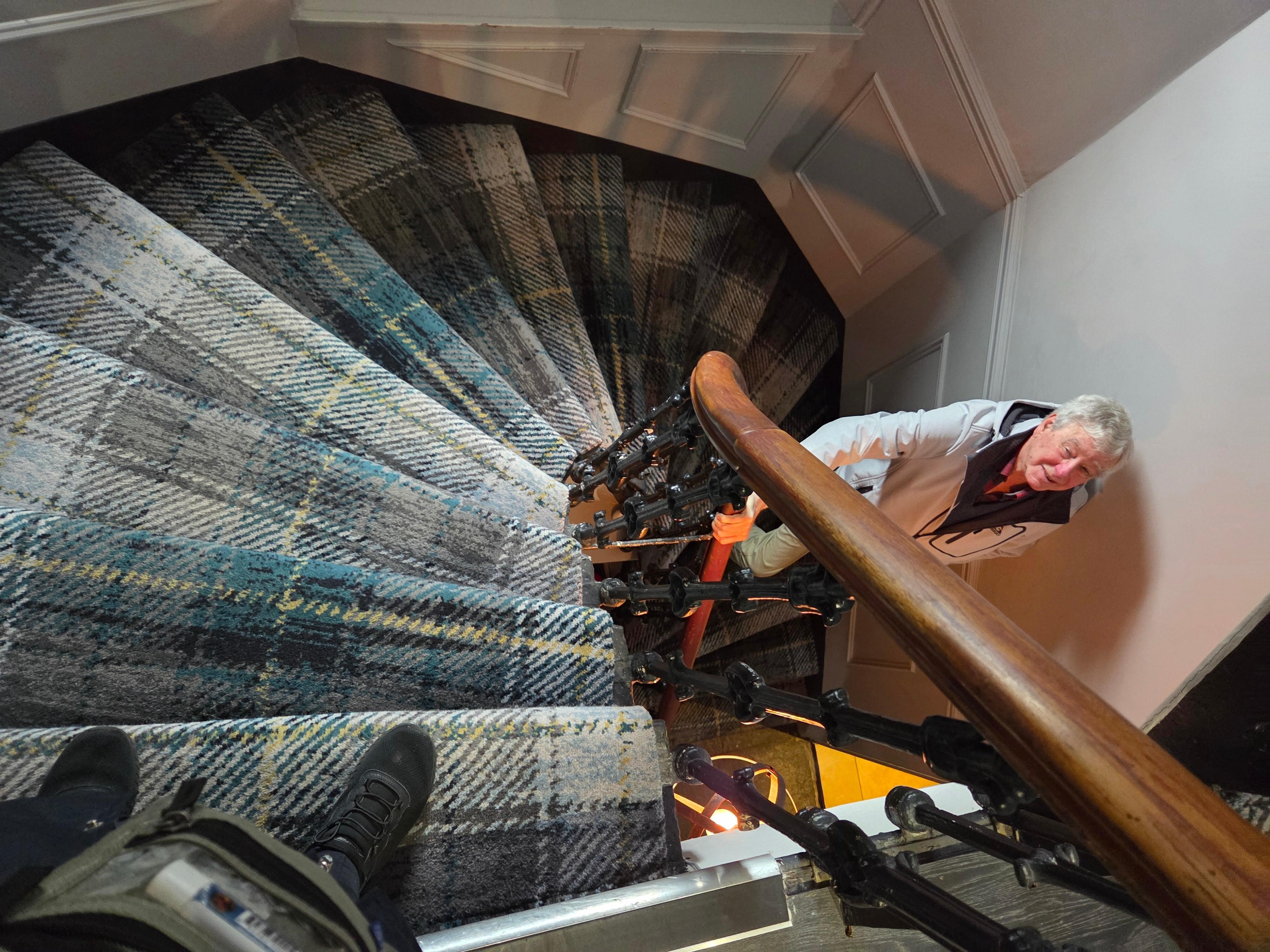 This was taken from the landing at the top of the second level of the staircase. The man is over 6 feet tall. 