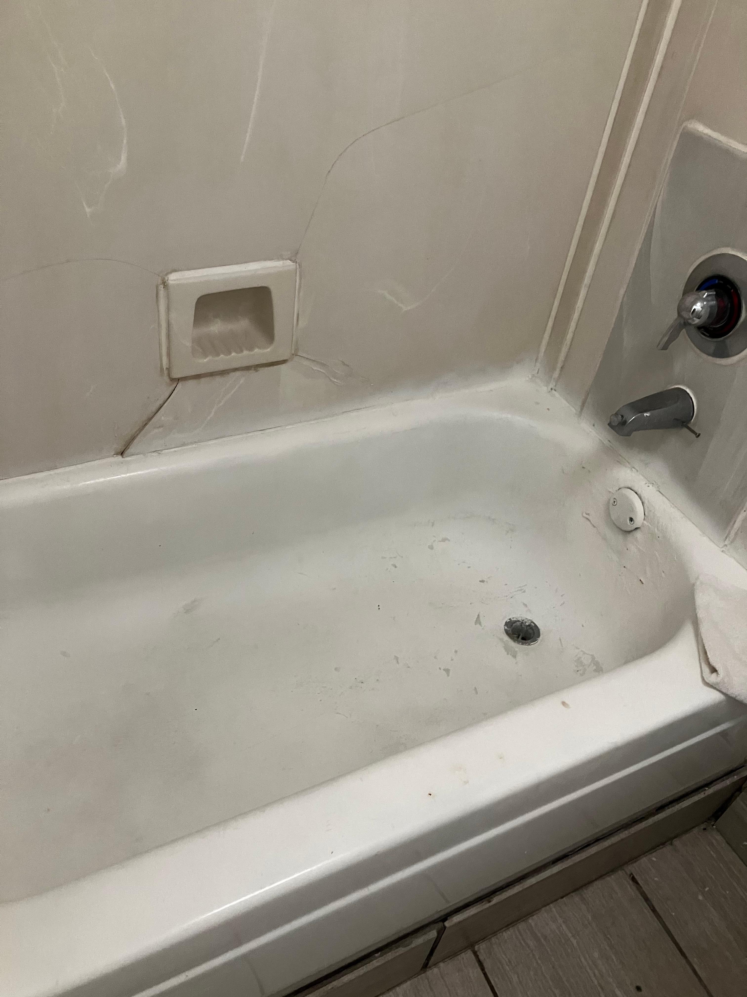 Shower surround cracked and broken- dirty