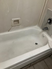 Shower surround cracked and broken- dirty