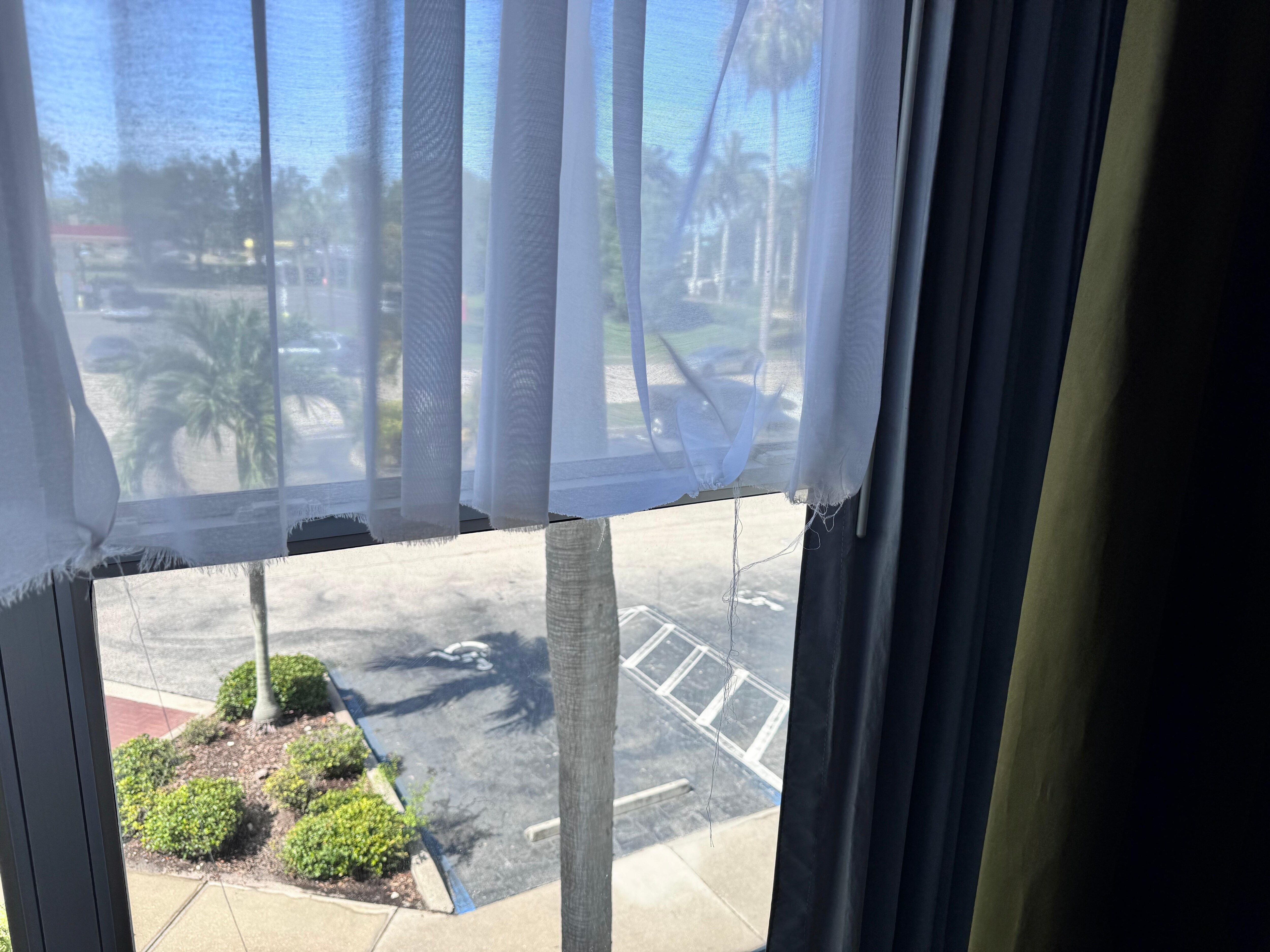 Privacy curtains on the front window were torn
