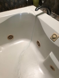 Blue goo oozing from the not-working in room spa tub! The only reason I booked this room! For my wife! To celebrate our anniversary!